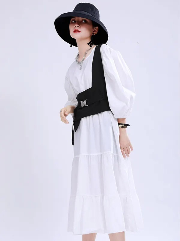 Chic Sophistication: Stylish Black Vest with a Trendy Belt Buckle